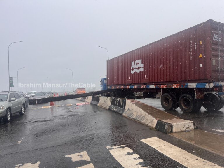 PHOTOS: Gridlock as container-laden truck crashes height barrier at Lekki-Ikoyi bridge | TheCable